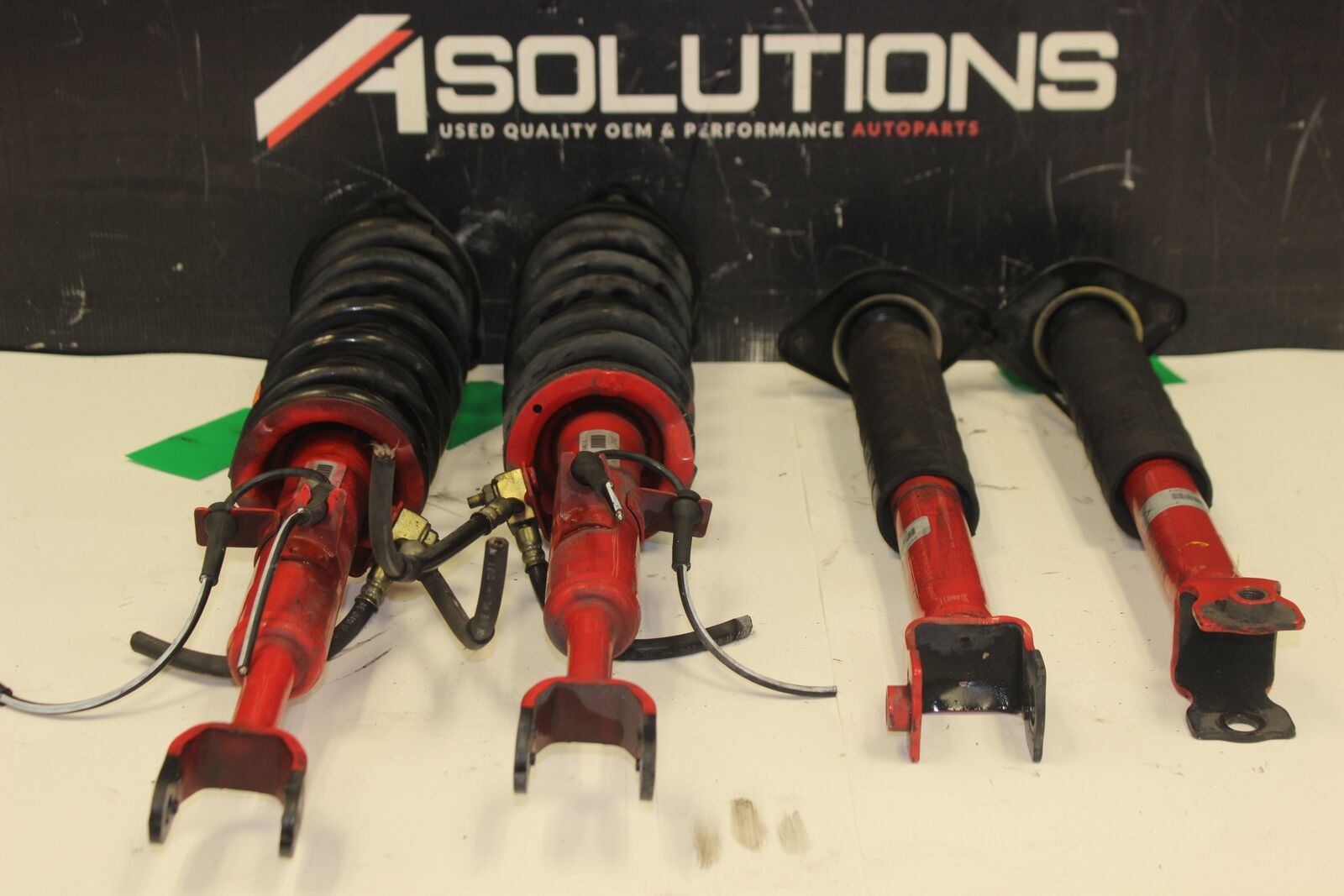 Infiniti G35 Stock OEM Shocks and Struts Tokico Red Color – A Solutions ...